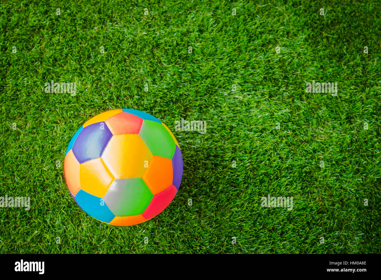 Real leather Colorful multi colour Soccer ball on green grass Stock ...