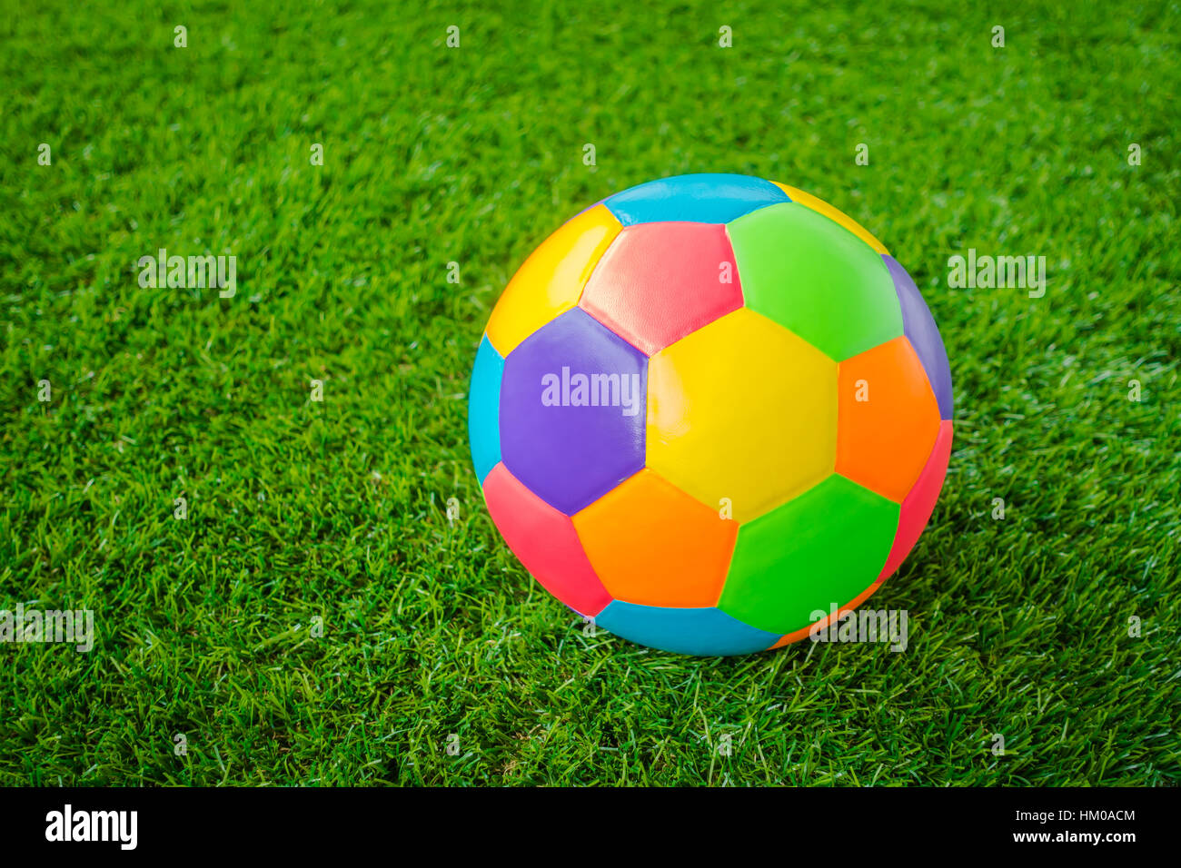 Real leather Colorful multi colour Soccer ball on green grass Stock ...