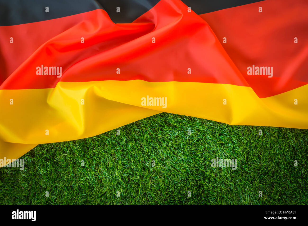 Flags of Germany on green grass Stock Photo - Alamy