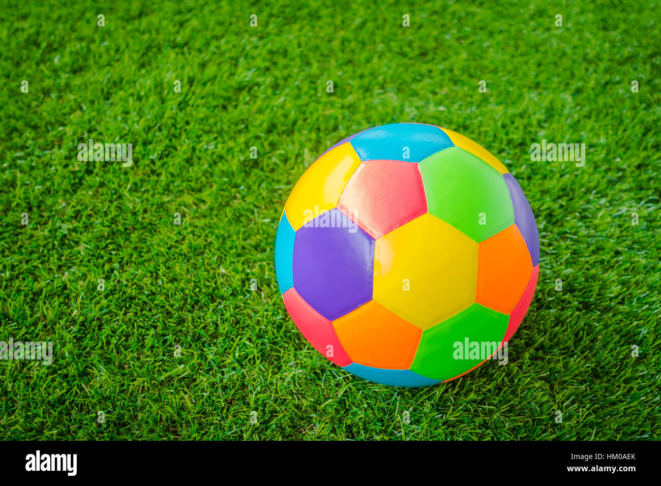 Real leather Colorful multi colour Soccer ball on green grass Stock ...
