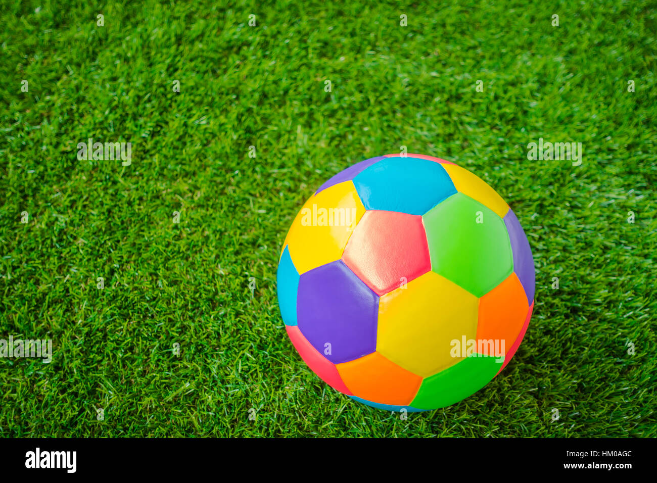 Real leather Colorful multi colour Soccer ball on green grass Stock ...