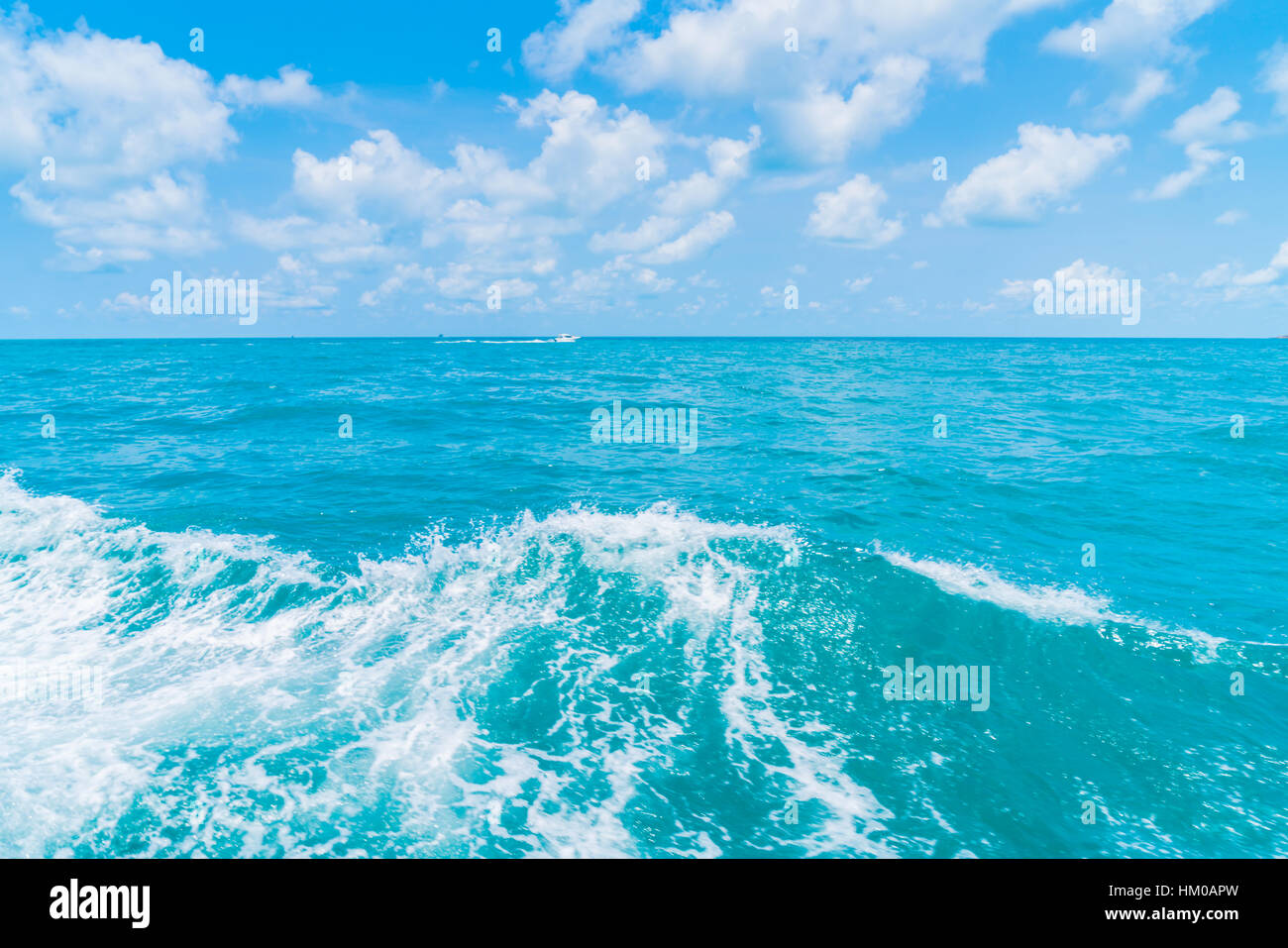 Trail on sea water surface behind boat Stock Photo - Alamy