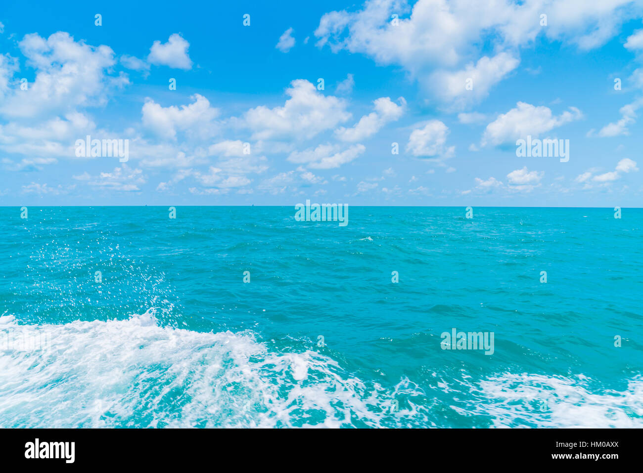 Trail on sea water surface behind boat Stock Photo - Alamy