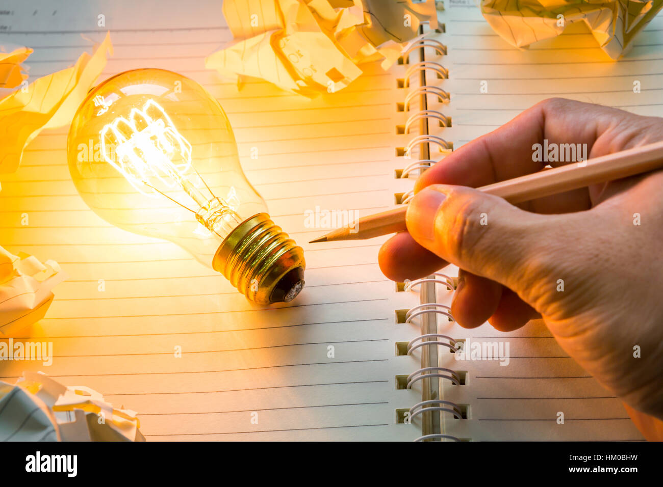Hand write over Note book and light bulb Stock Photo - Alamy