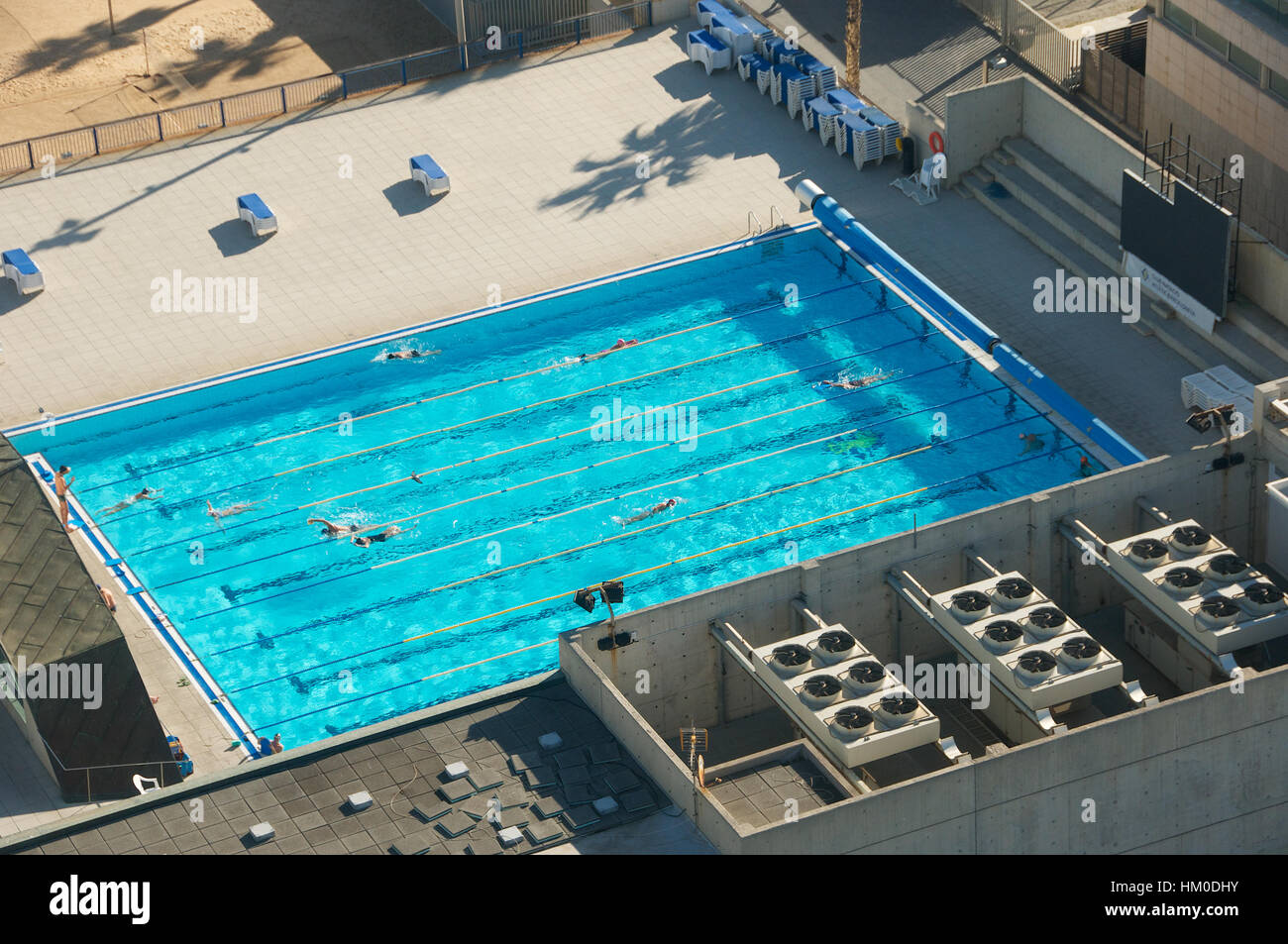 Aerial view of a swimming pool and swimmers in Barcelona, Catalonia ...