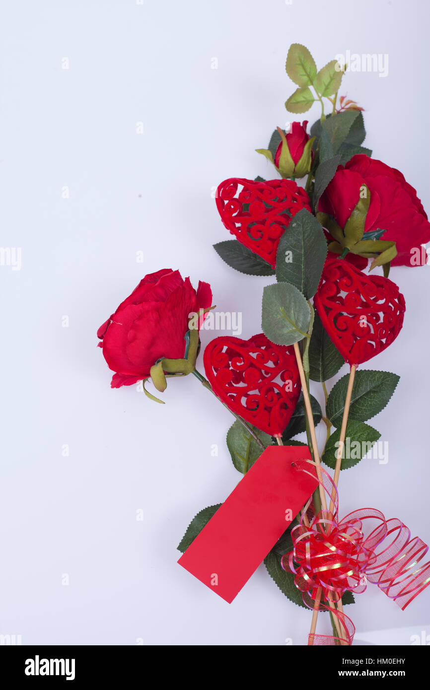 Beautiful roses with hearts on a white background Stock Photo - Alamy