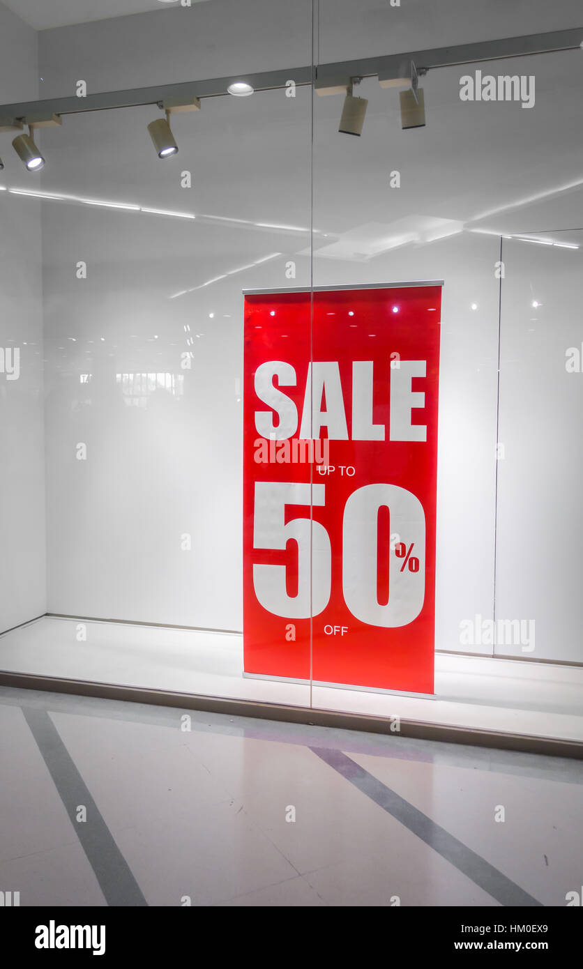 Red store discount sign on a shop window Stock Photo - Alamy
