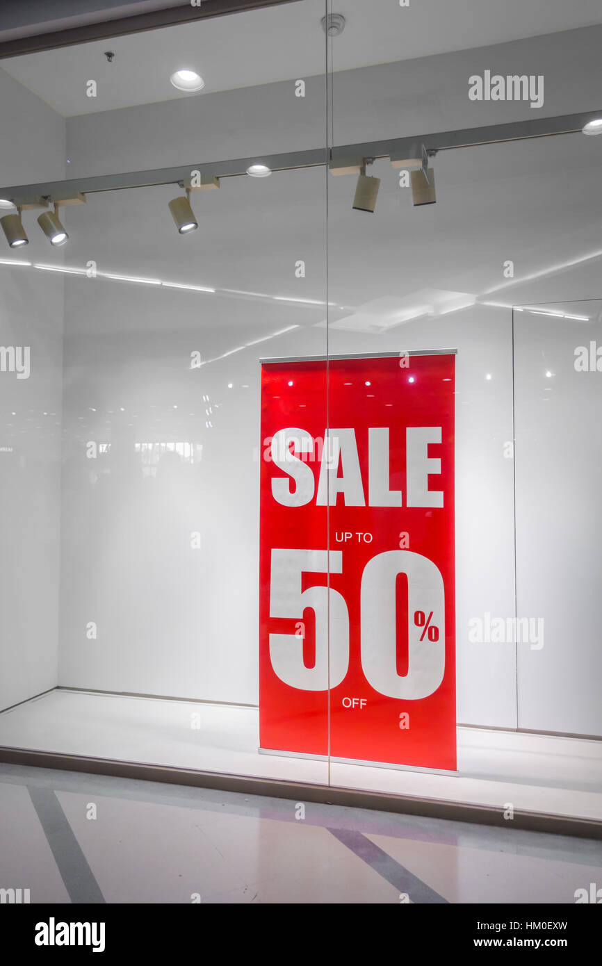 Red store discount sign on a shop window Stock Photo - Alamy