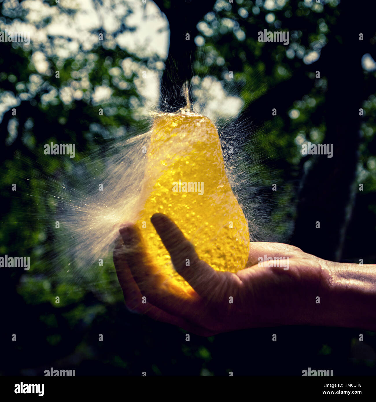 Water in shape of pear exploding. water explosion Stock Photo - Alamy
