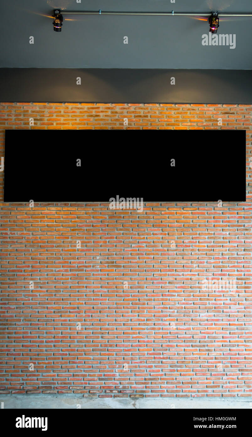 Blank black sign on brick wall Stock Photo - Alamy