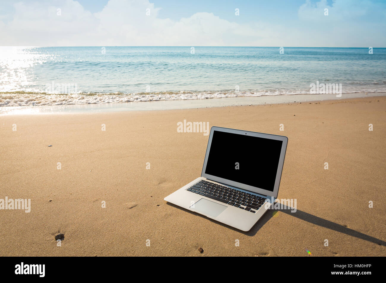 Laptop on the beach in summer time Stock Photo - Alamy