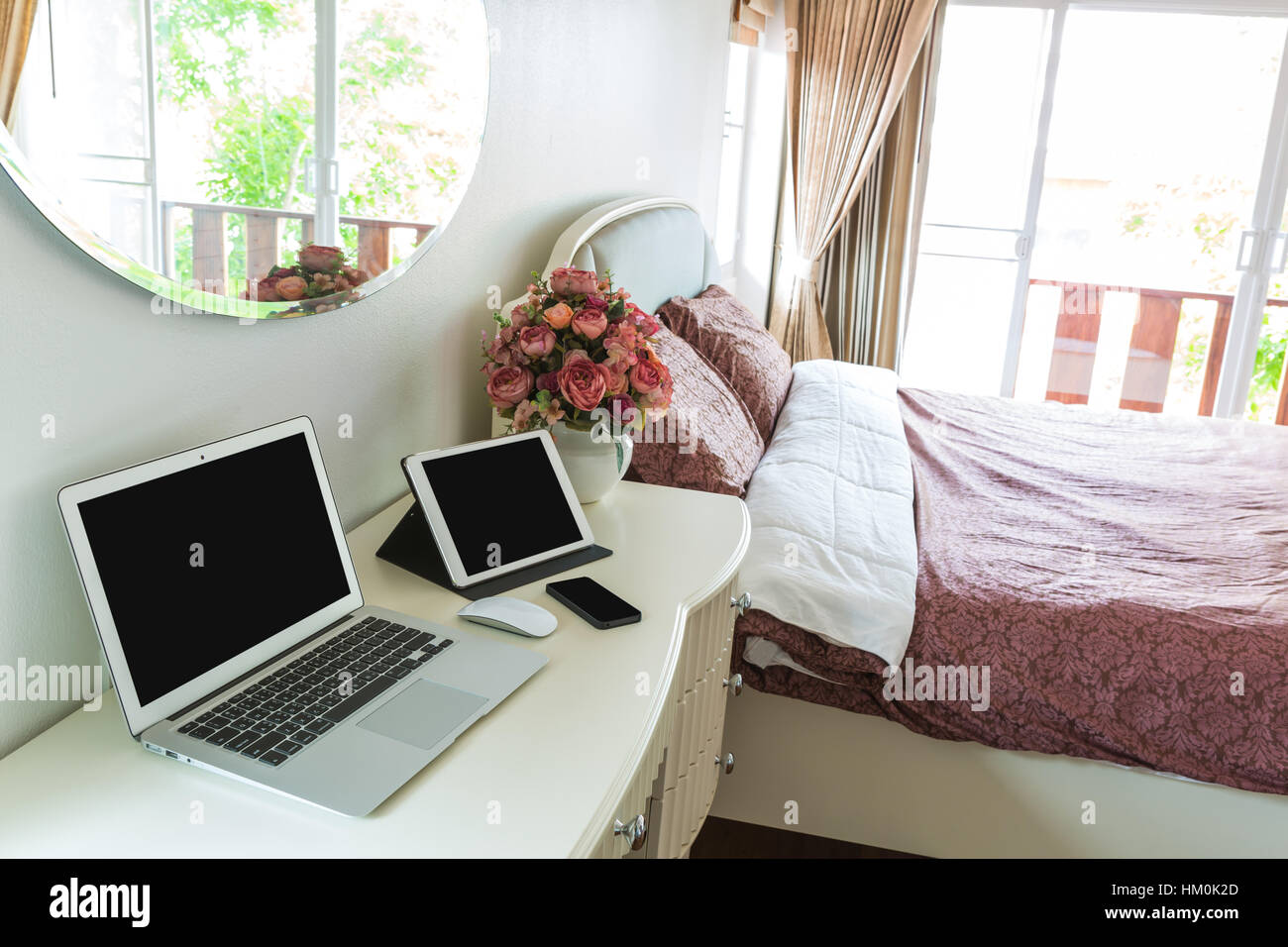 Interior of a modern bed room with laptop computer Stock Photo - Alamy