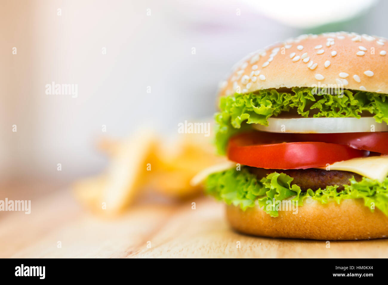 Hamburger on wood table ,sun flare filter effect Stock Photo - Alamy
