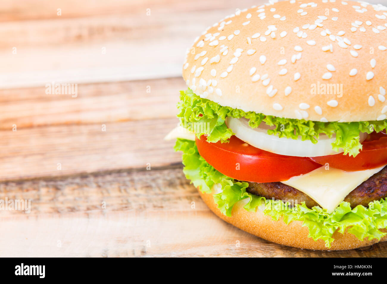 Hamburger on wood table ,sun flare filter effect Stock Photo - Alamy