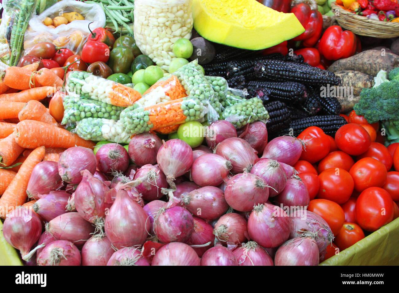Bin of colorful, fresh vegetables at outdoor market in Peru Stock Photo ...