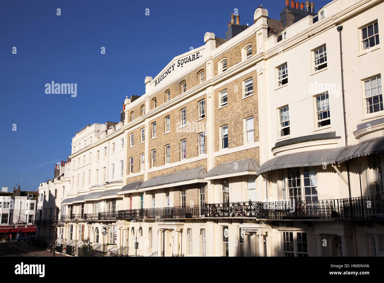 row of beautiful regency terraced houses on brighton seafront in west ...