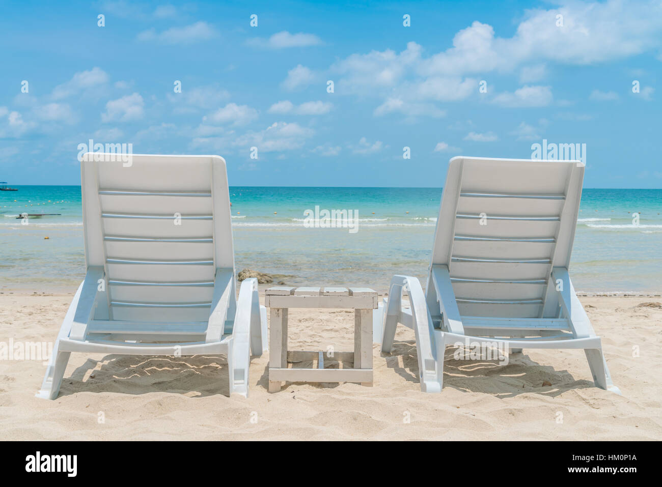 Beautiful beach chairs on tropical white sand beach Stock Photo - Alamy