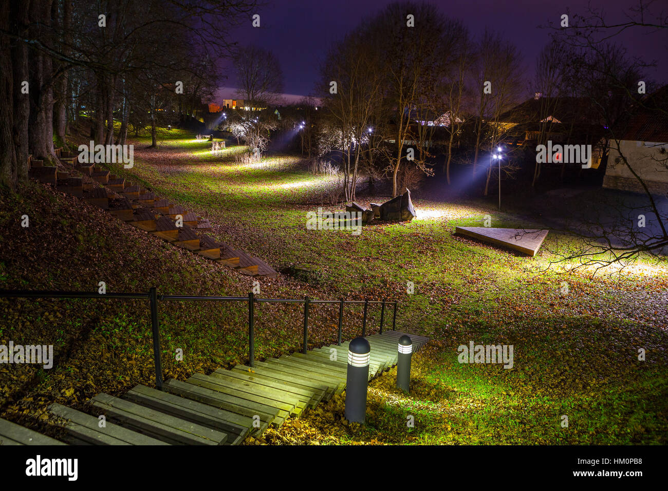 Night illuminated park with lanterns and wooden stairs from hill Stock ...