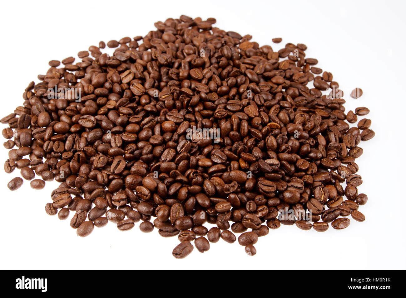 Coffee beans on plain background Stock Photo - Alamy
