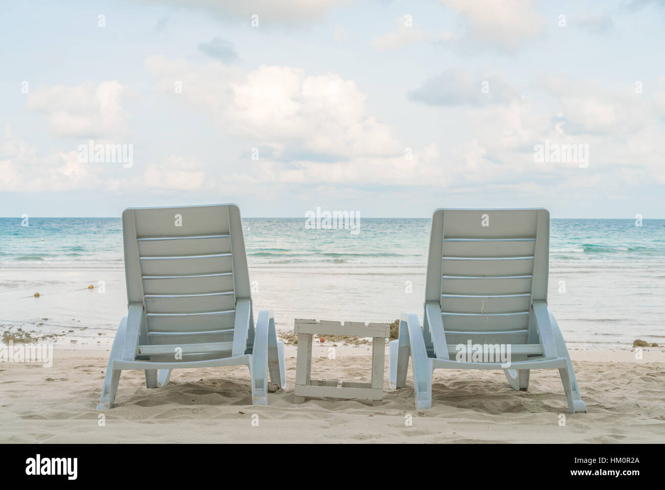 Beautiful beach chairs on tropical white sand beach Stock Photo - Alamy