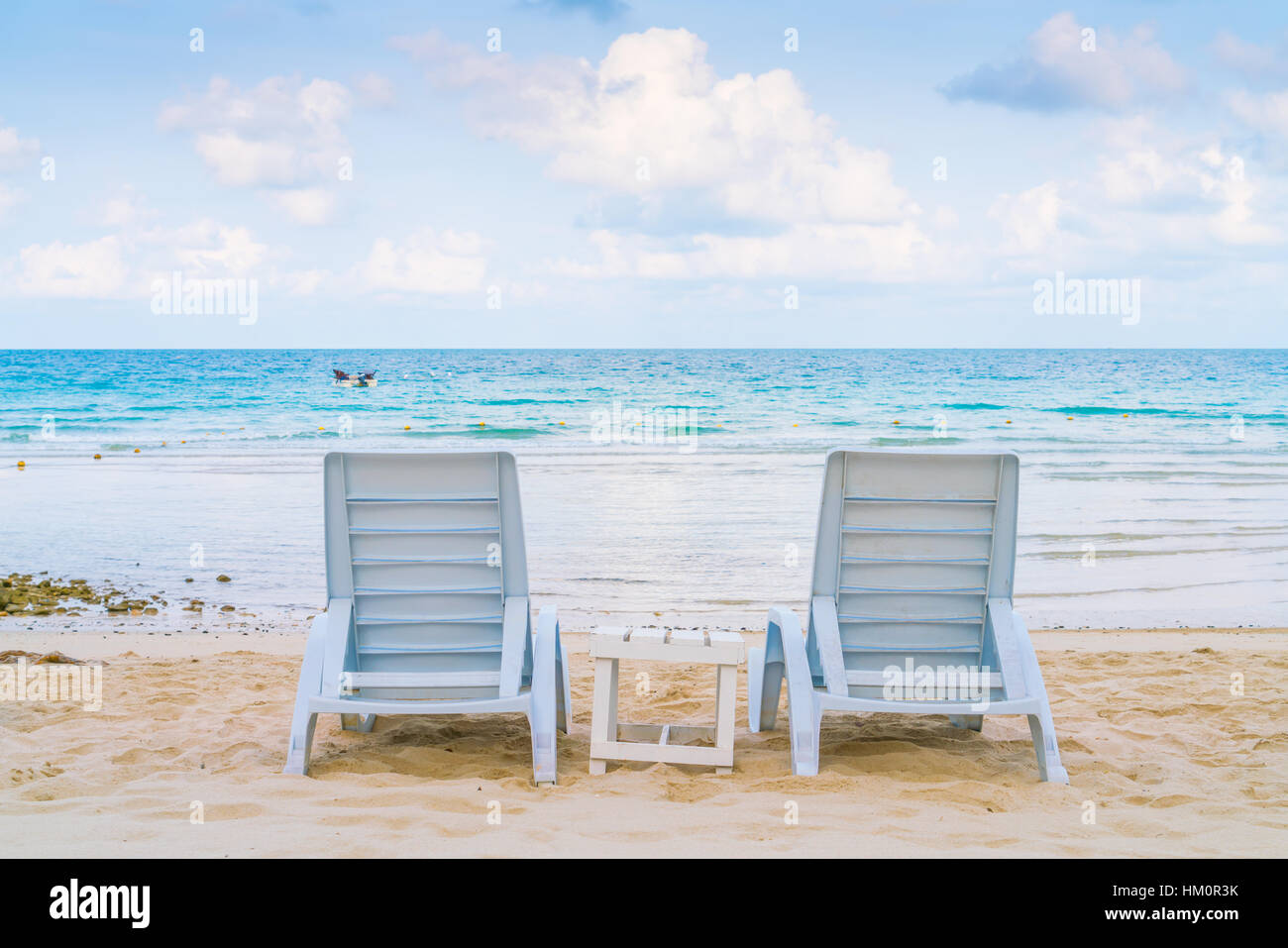 Beautiful beach chairs on tropical white sand beach Stock Photo - Alamy