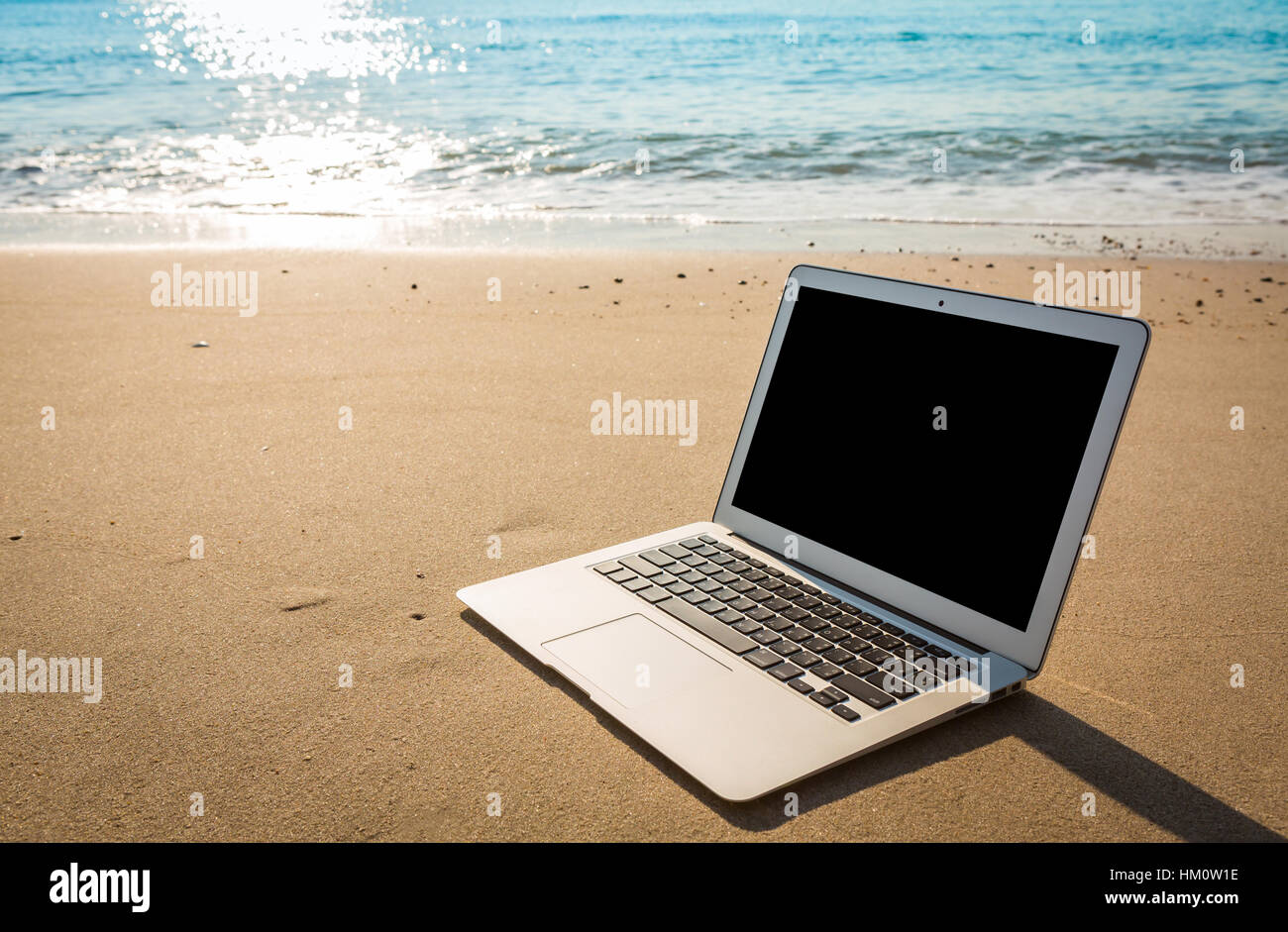 Laptop on the beach in summer time Stock Photo - Alamy