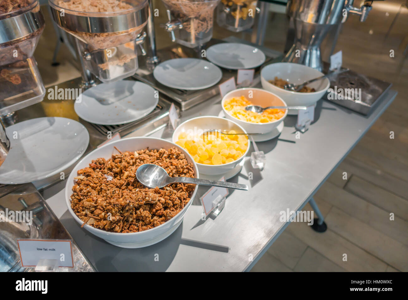 Cereal dispensers offering various kind of cereals in buffet at hotel ...