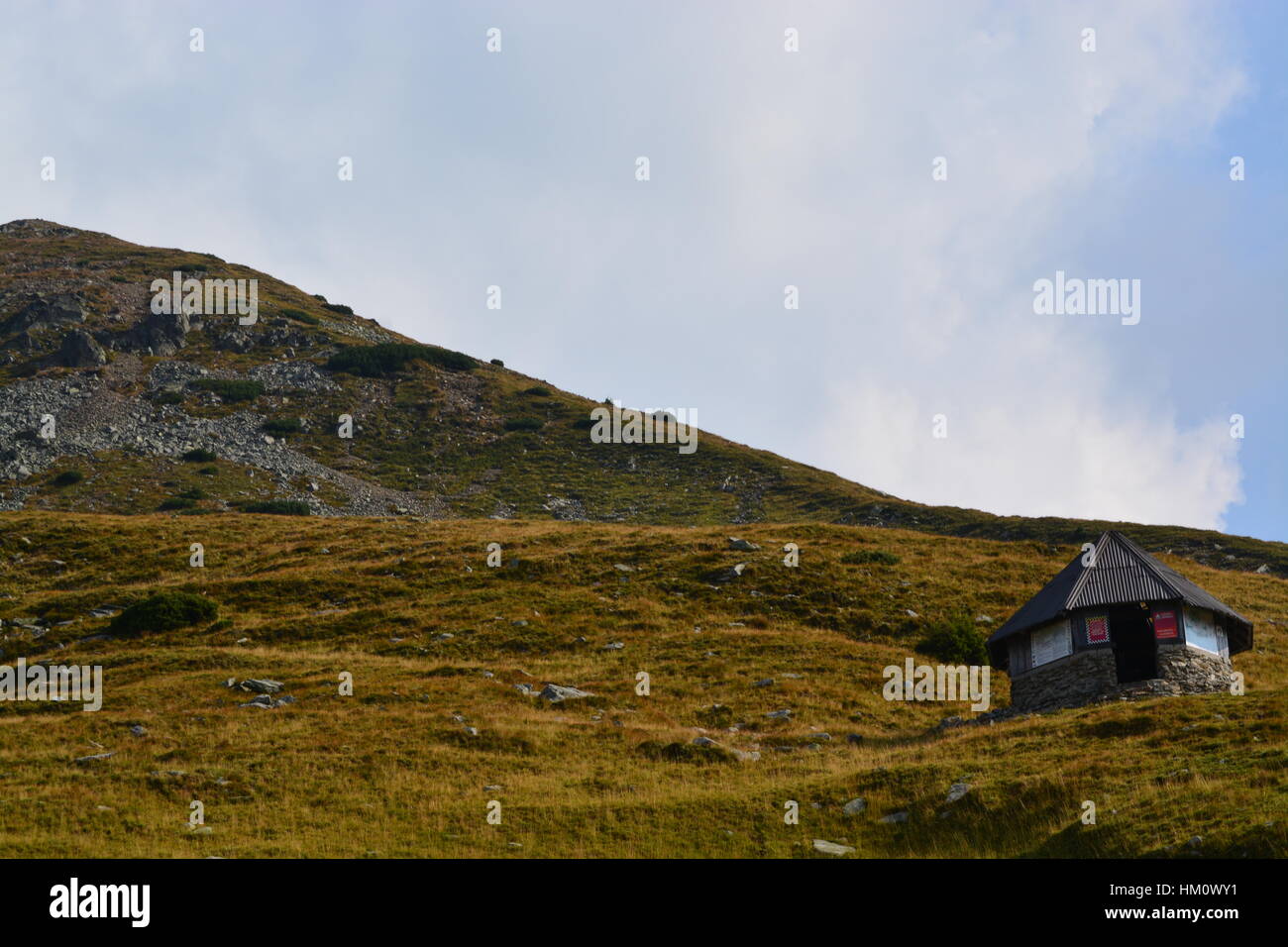 Small wooden shack on the side of the mountain Stock Photo - Alamy