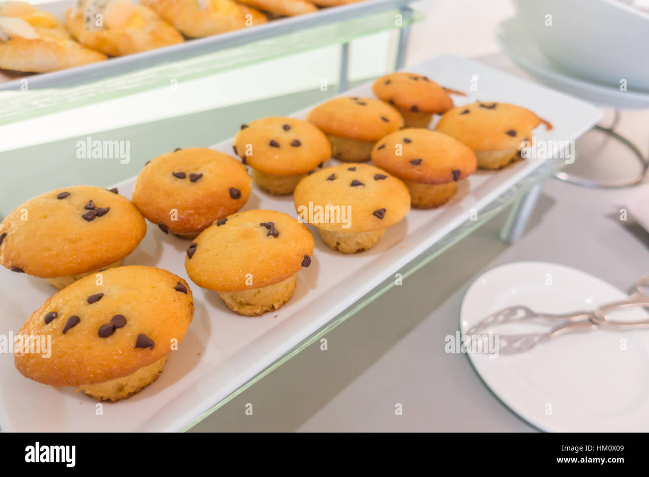 Chocolate chip muffins on table in buffet Stock Photo - Alamy