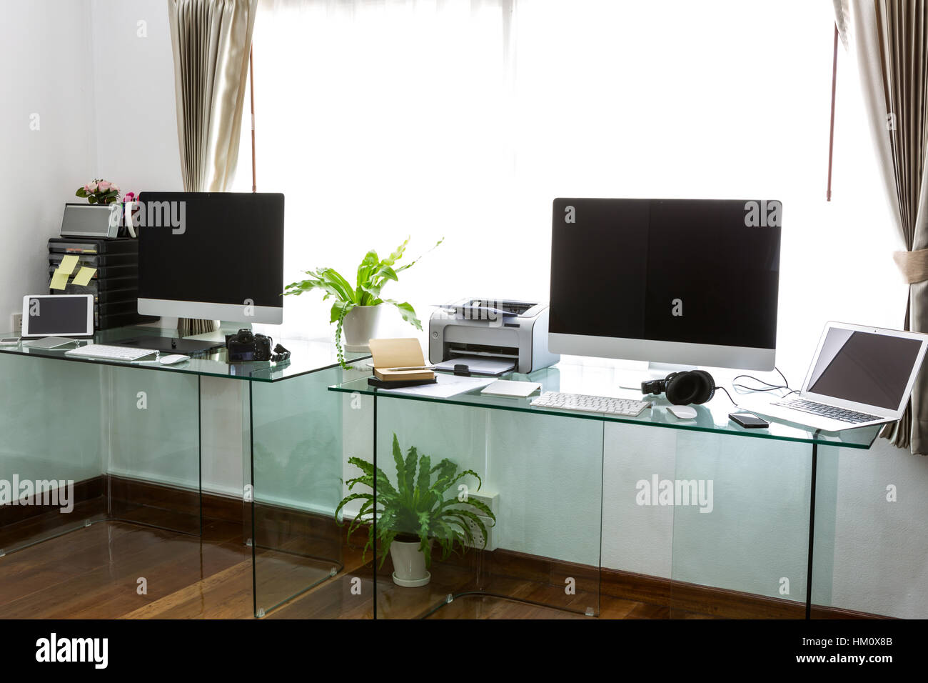 Modern home office with computer and labtop Stock Photo - Alamy