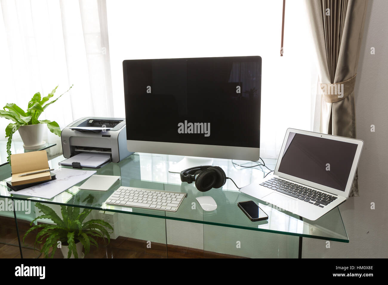 Modern home office with computer and labtop Stock Photo - Alamy