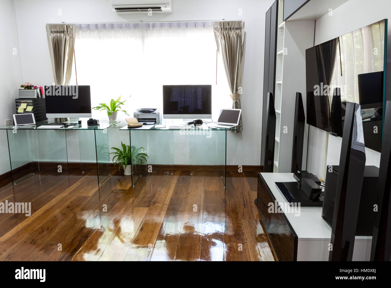 Modern office with computer and labtop with home theater Stock Photo ...