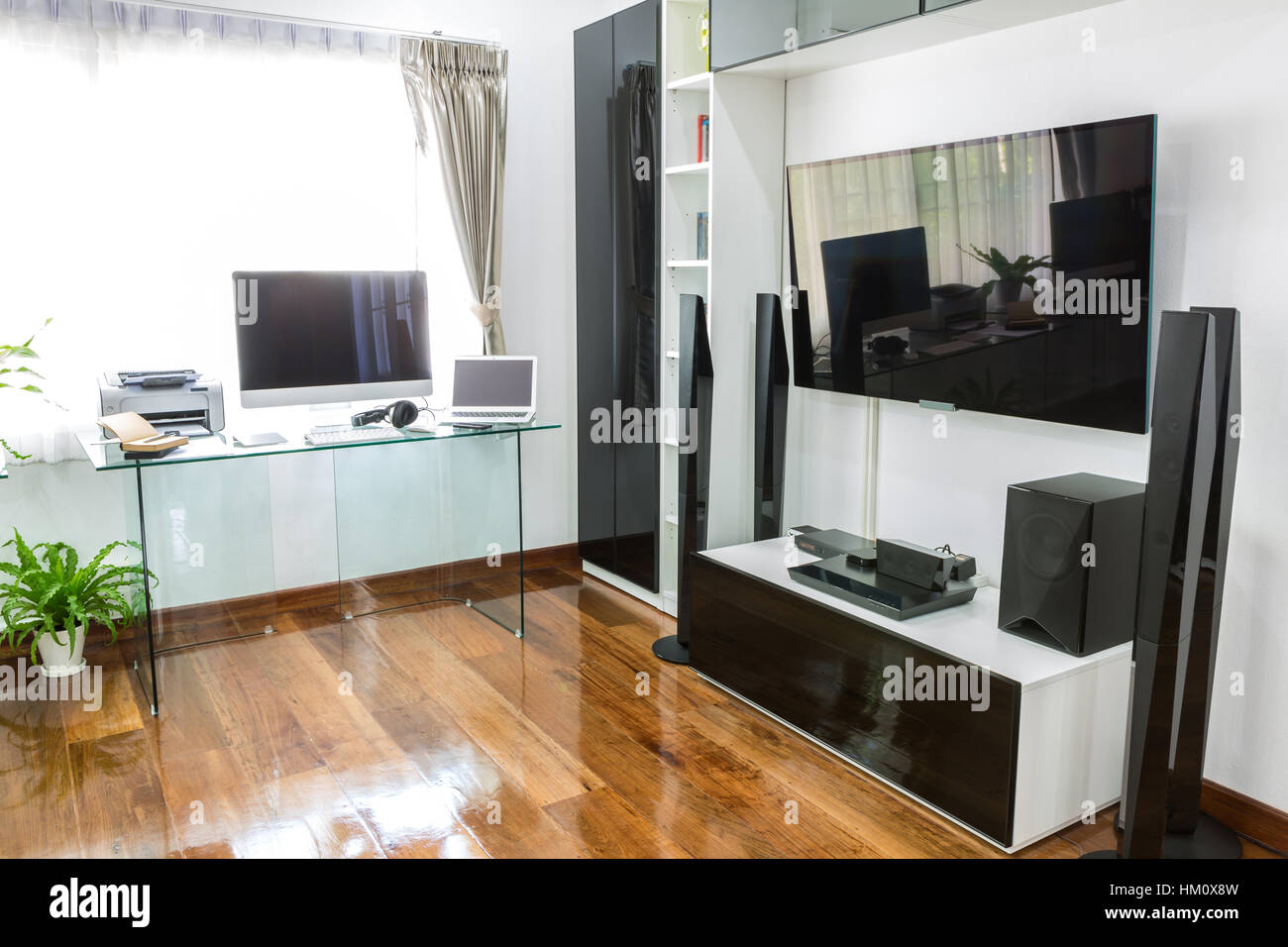 Modern office with computer and laptop with home theater Stock Photo ...