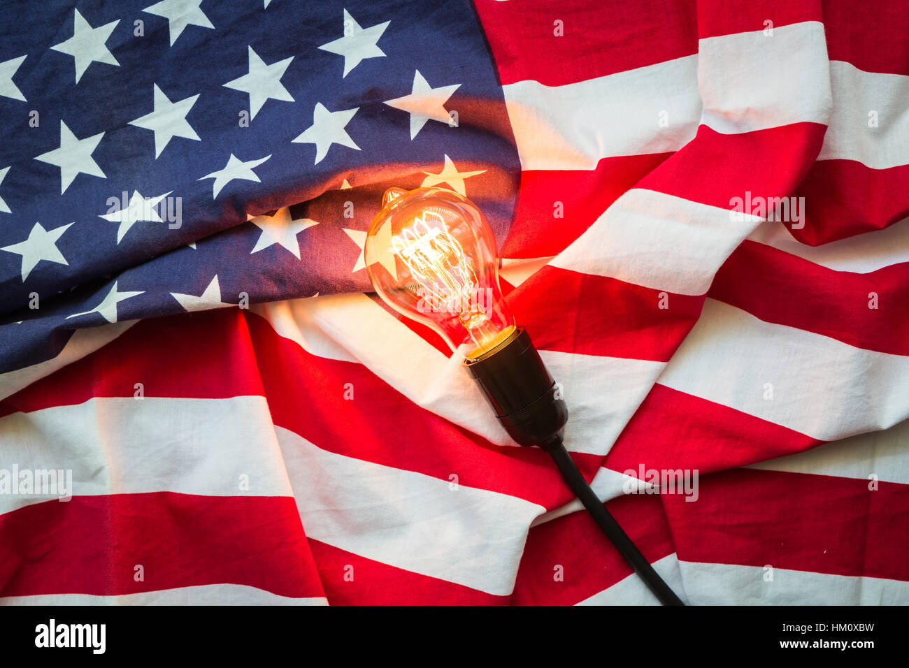 Light bulb on USA flag Stock Photo - Alamy