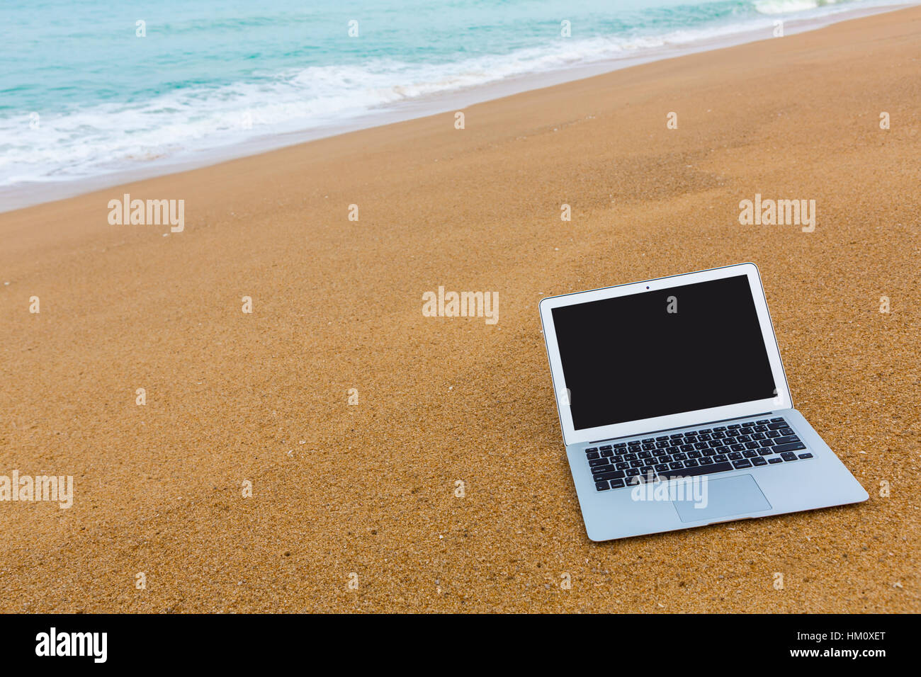 Laptop on the beach in summer time Stock Photo - Alamy