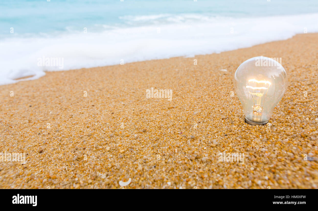 Light bulb on the beach Stock Photo - Alamy
