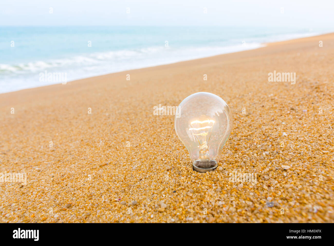 Light bulb on the beach Stock Photo - Alamy