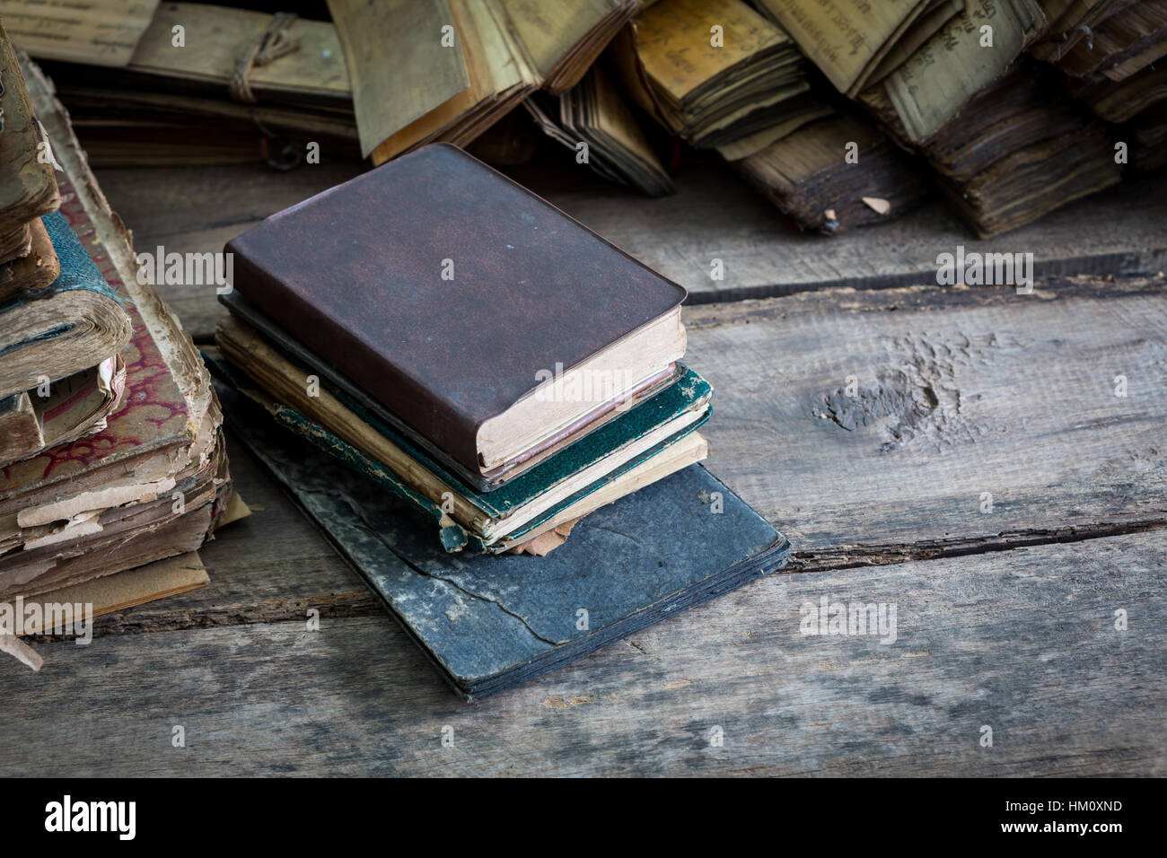 Vintage old books on wooden table Stock Photo - Alamy