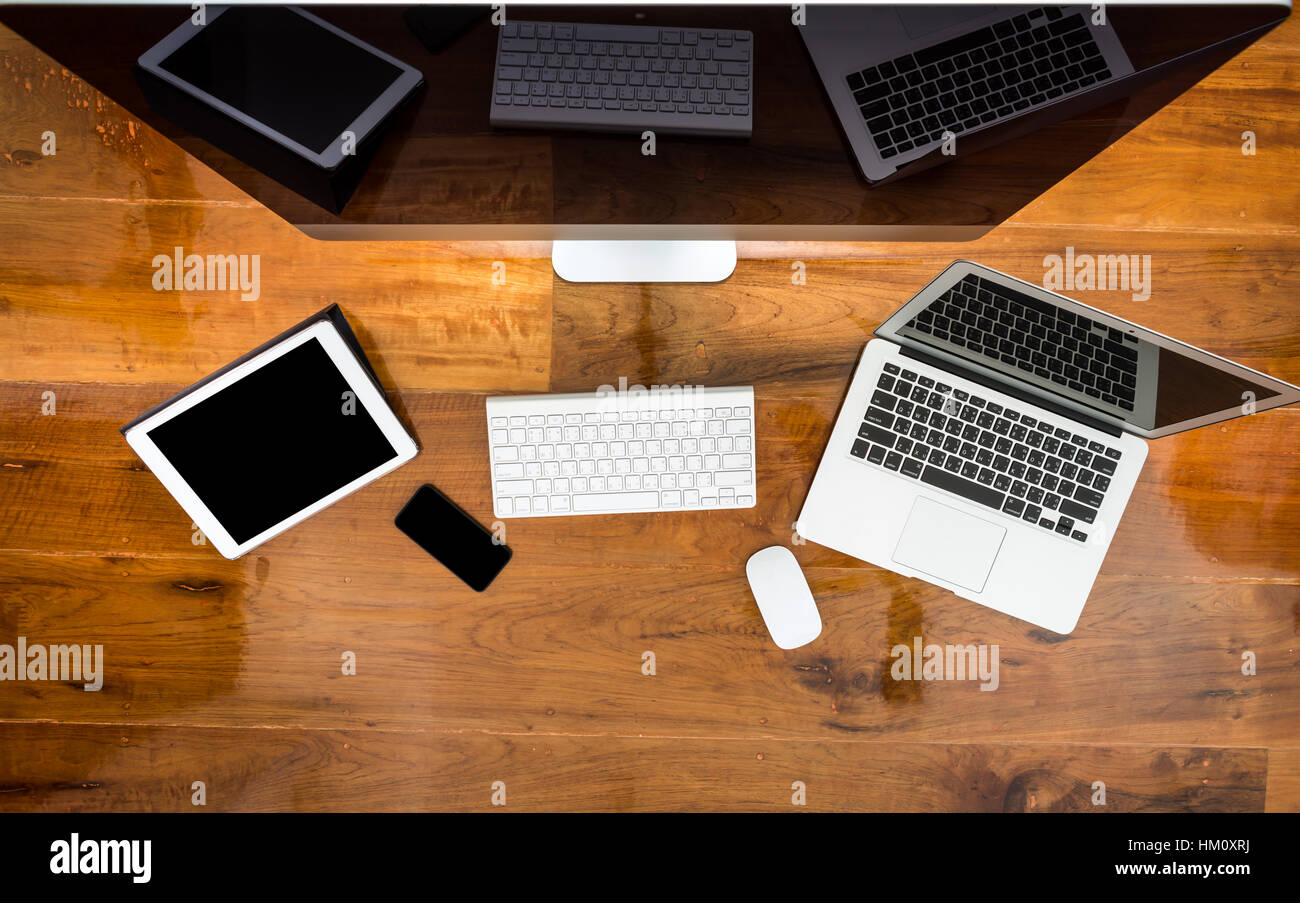 Computer ,laptop , tablet , smart phone on wood table Stock Photo - Alamy