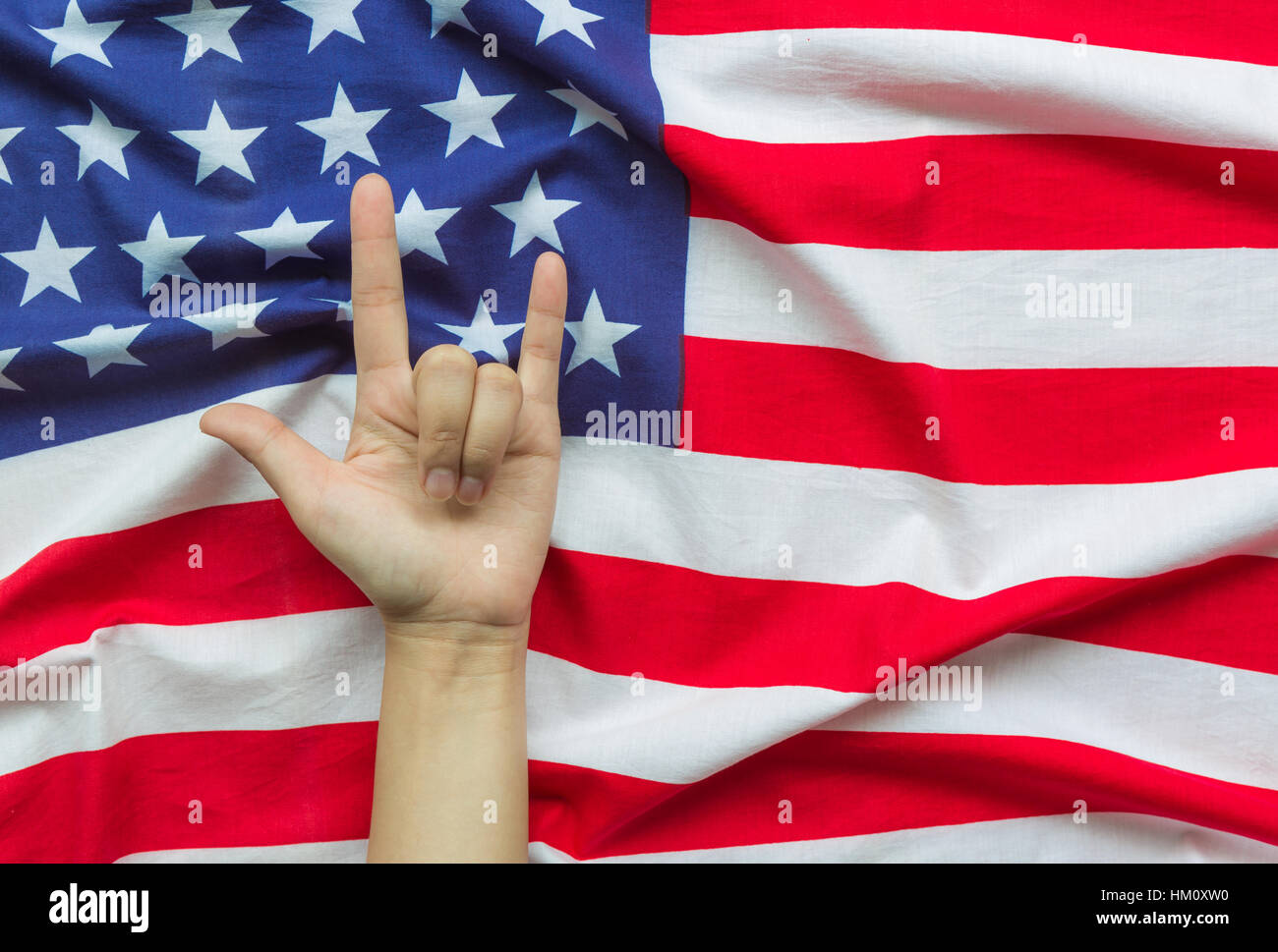 Hand over American flag Stock Photo - Alamy
