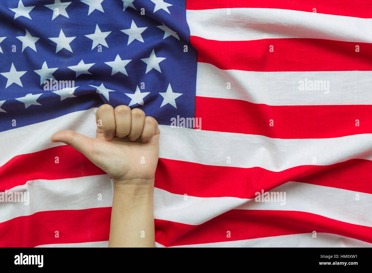 Hand over American flag Stock Photo - Alamy
