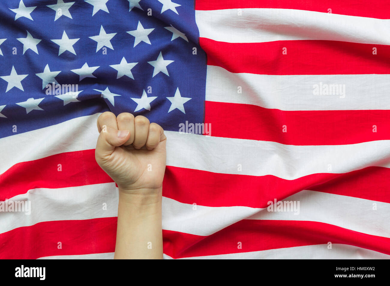 Hand over American flag Stock Photo - Alamy
