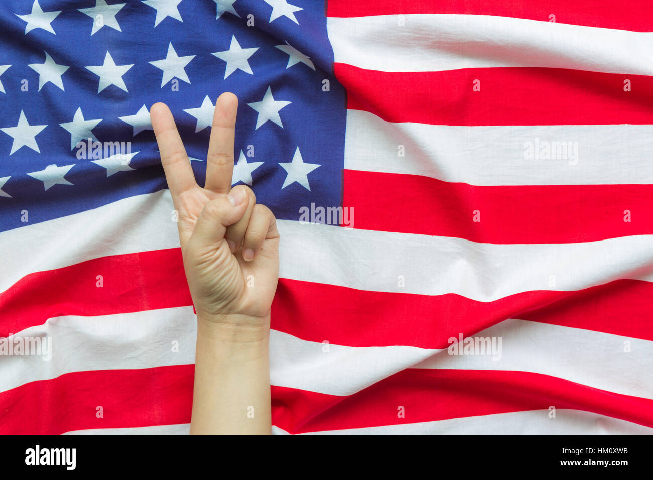 Hand over American flag Stock Photo - Alamy