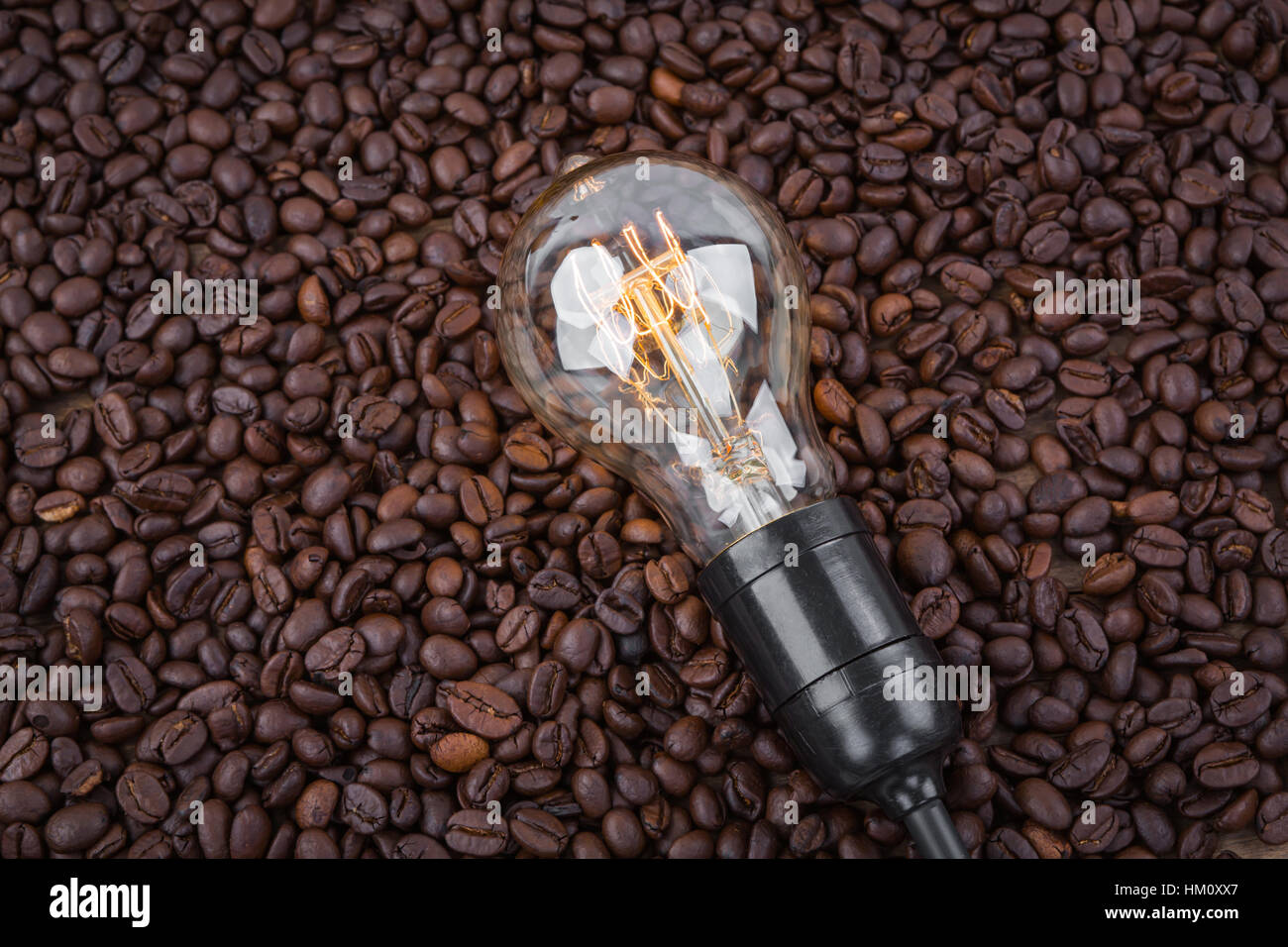 Light bulb on coffee beans Stock Photo - Alamy