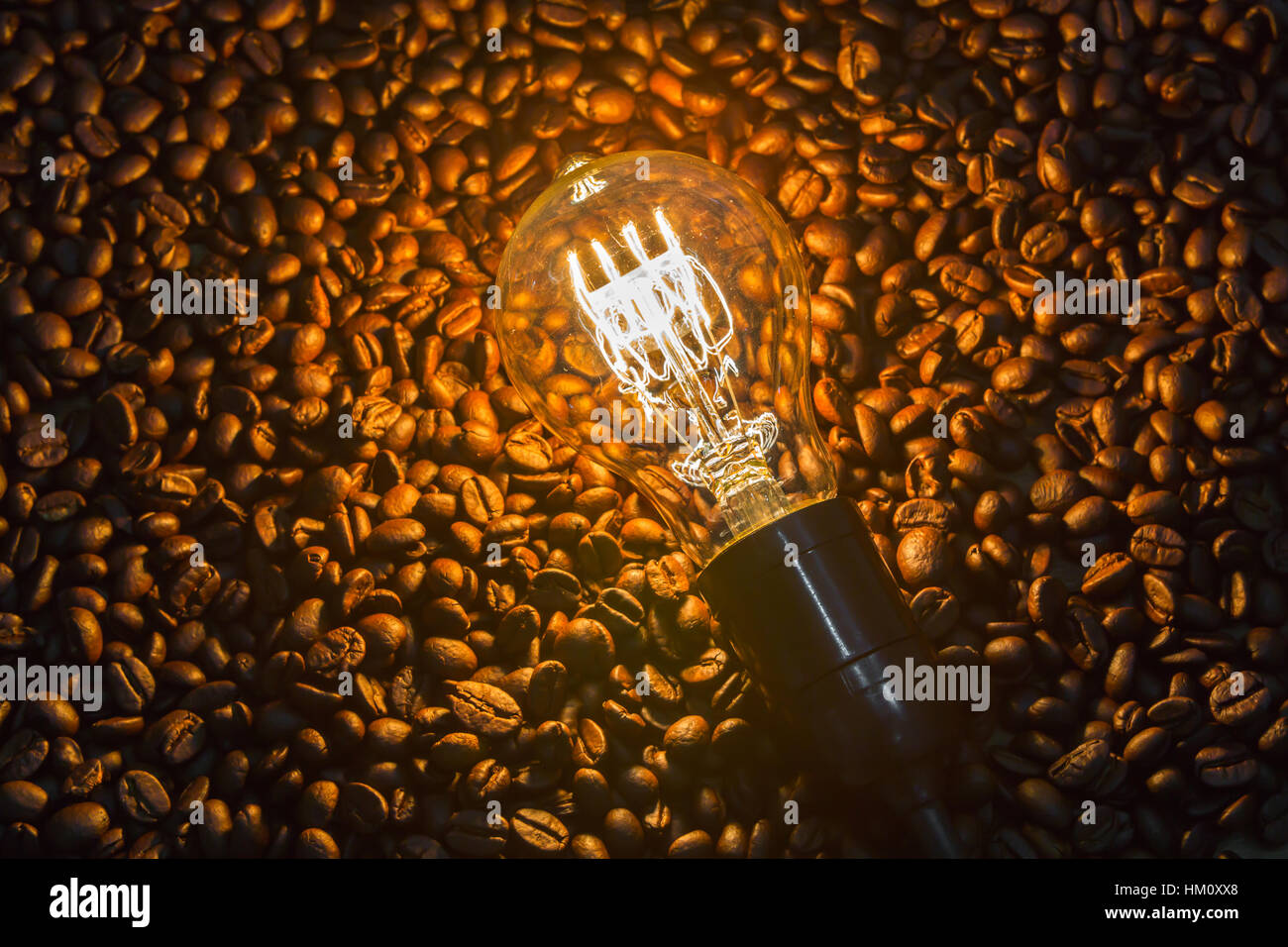 Light bulb on coffee beans Stock Photo - Alamy