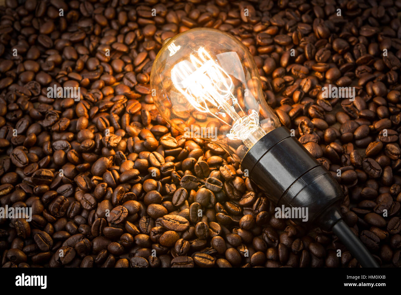 Light bulb on coffee beans Stock Photo - Alamy