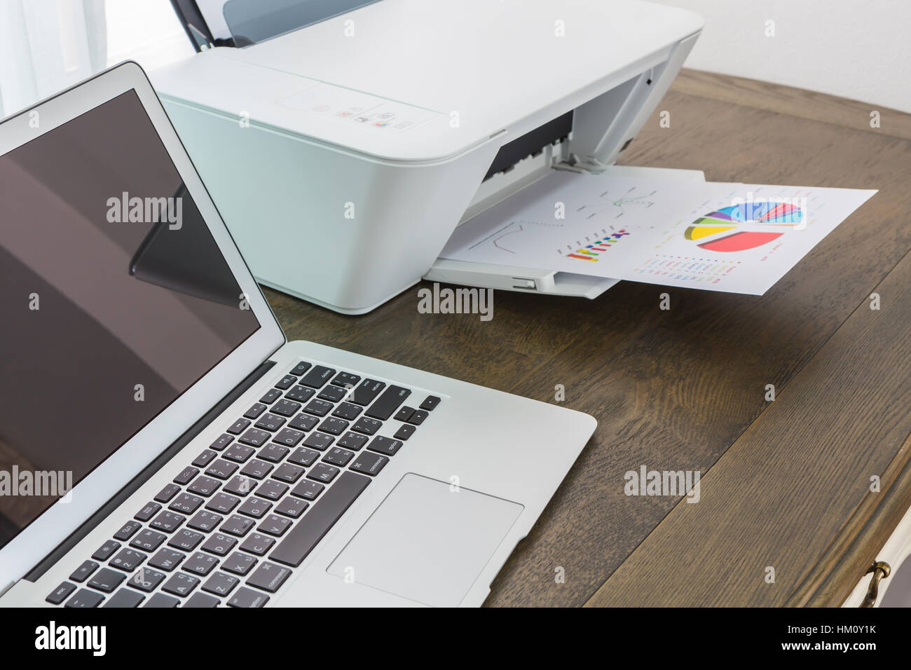 printer and Laptop on wood table Stock Photo - Alamy