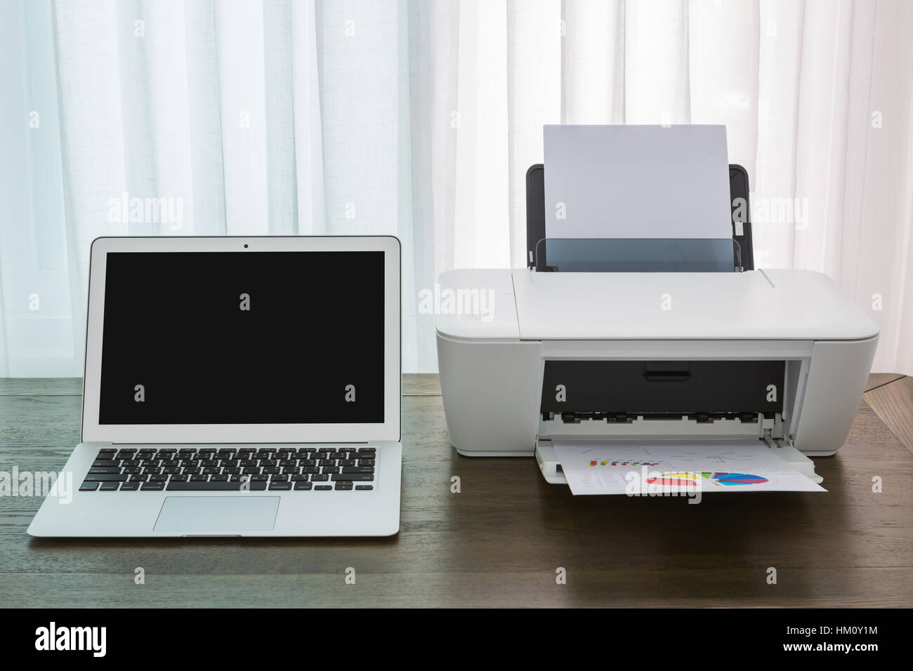 printer and Laptop on wood table Stock Photo - Alamy