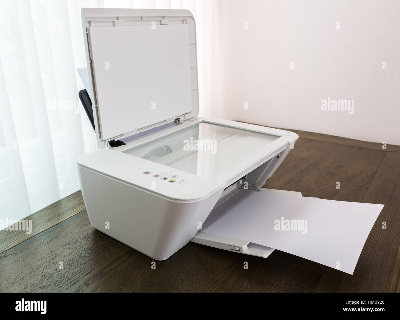 Printer with blank paper on a wood table Stock Photo - Alamy