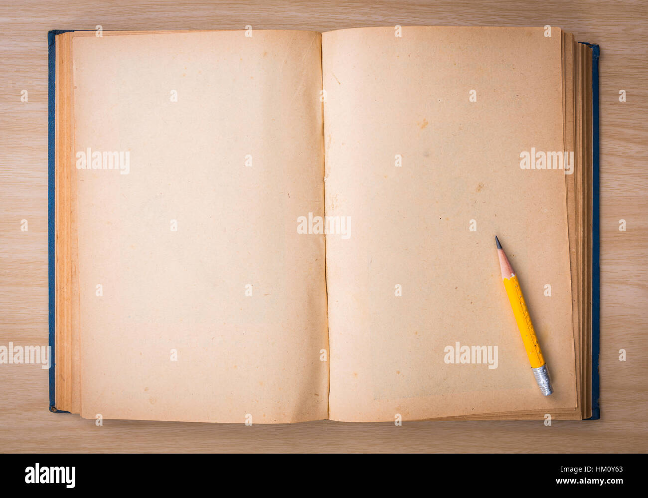 Open blank pages of old book on wood background Stock Photo - Alamy